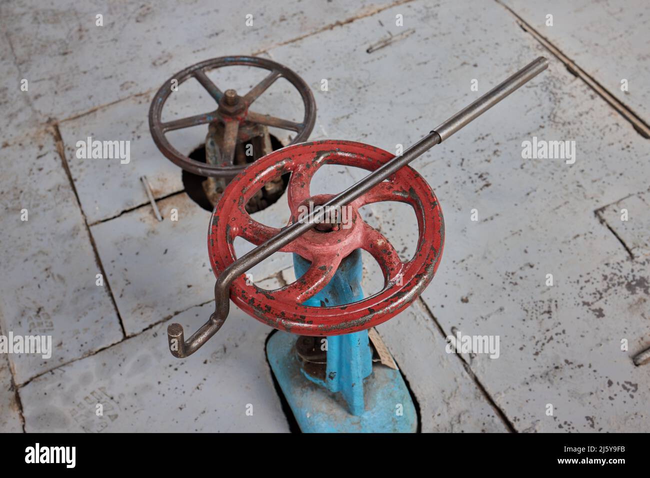 Close-up at pipeline valve which is using to control production process ...