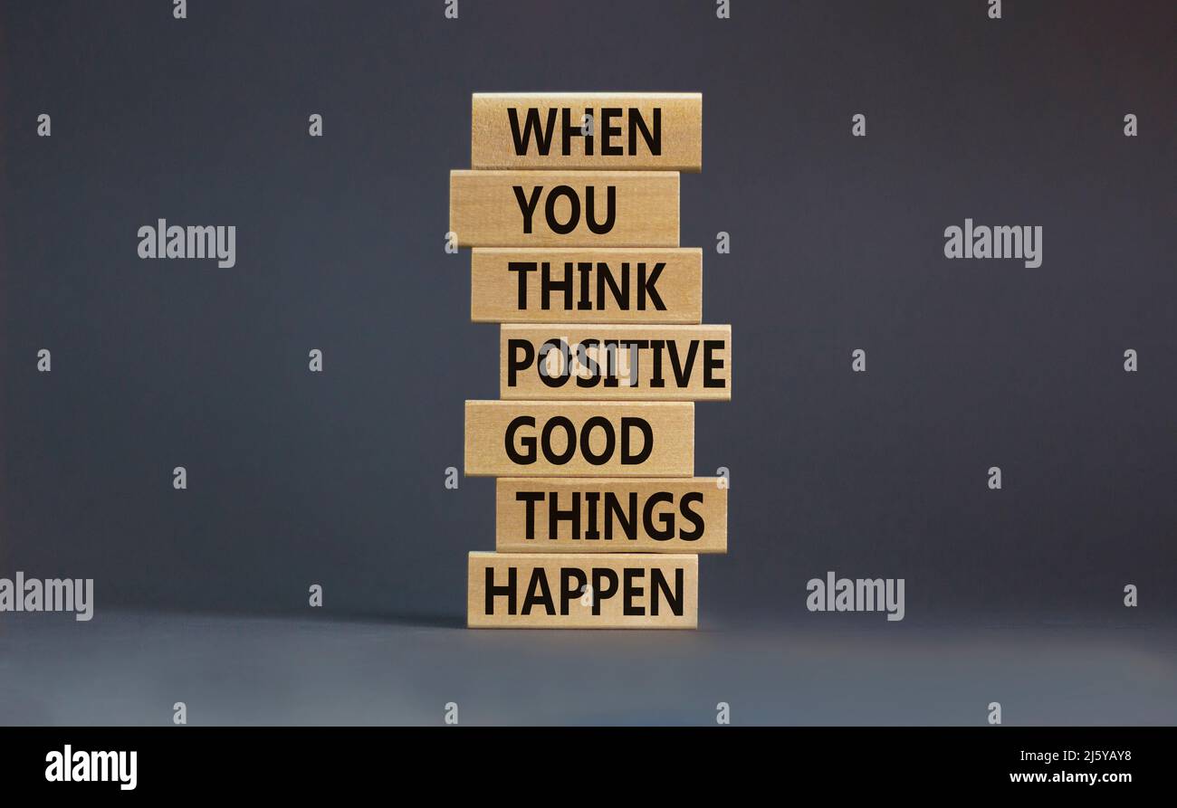 Think positive symbol. Wooden blocks with concept words When you think ...