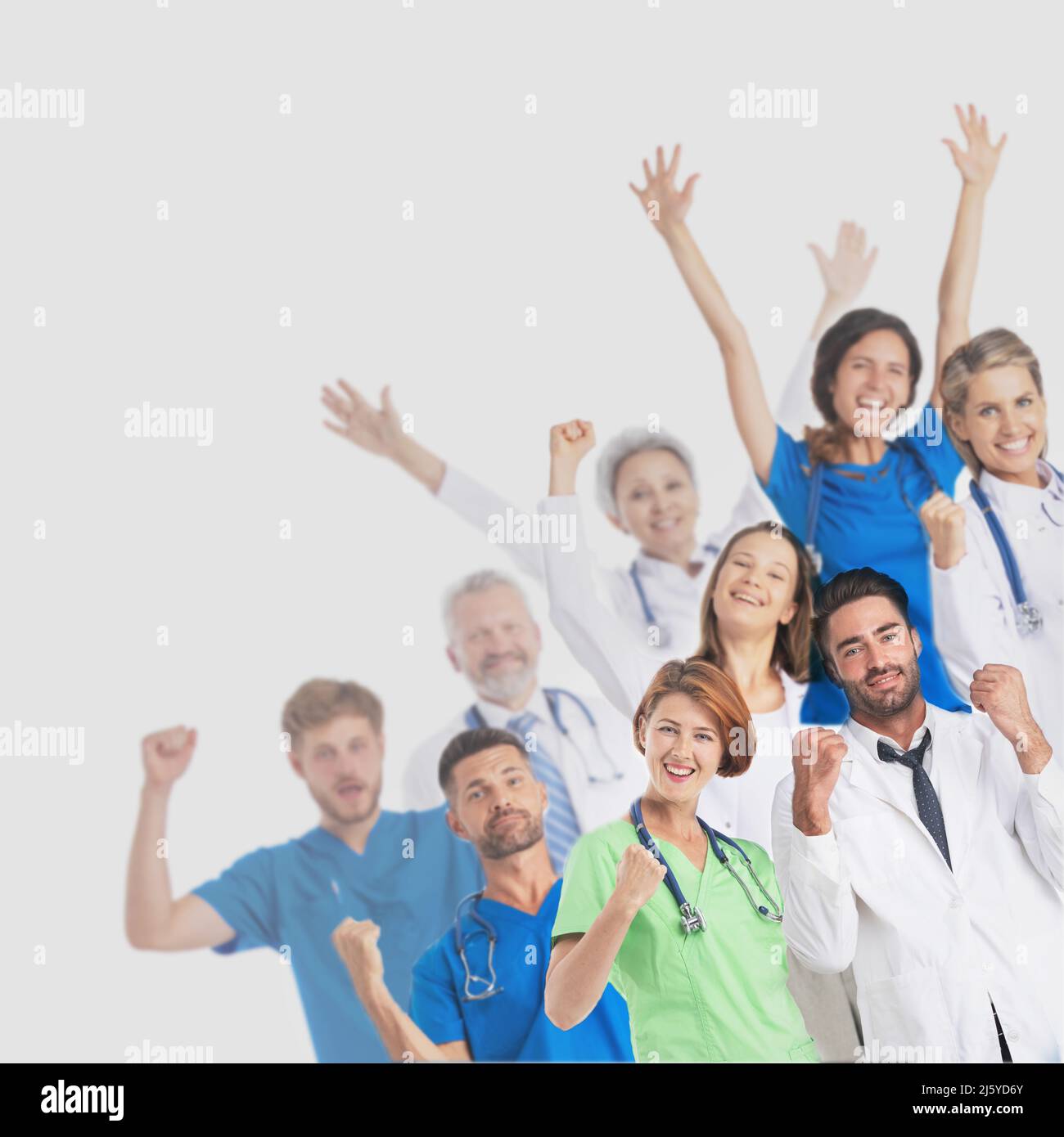 Medical team of male and female doctors and nurses celebrating with ...