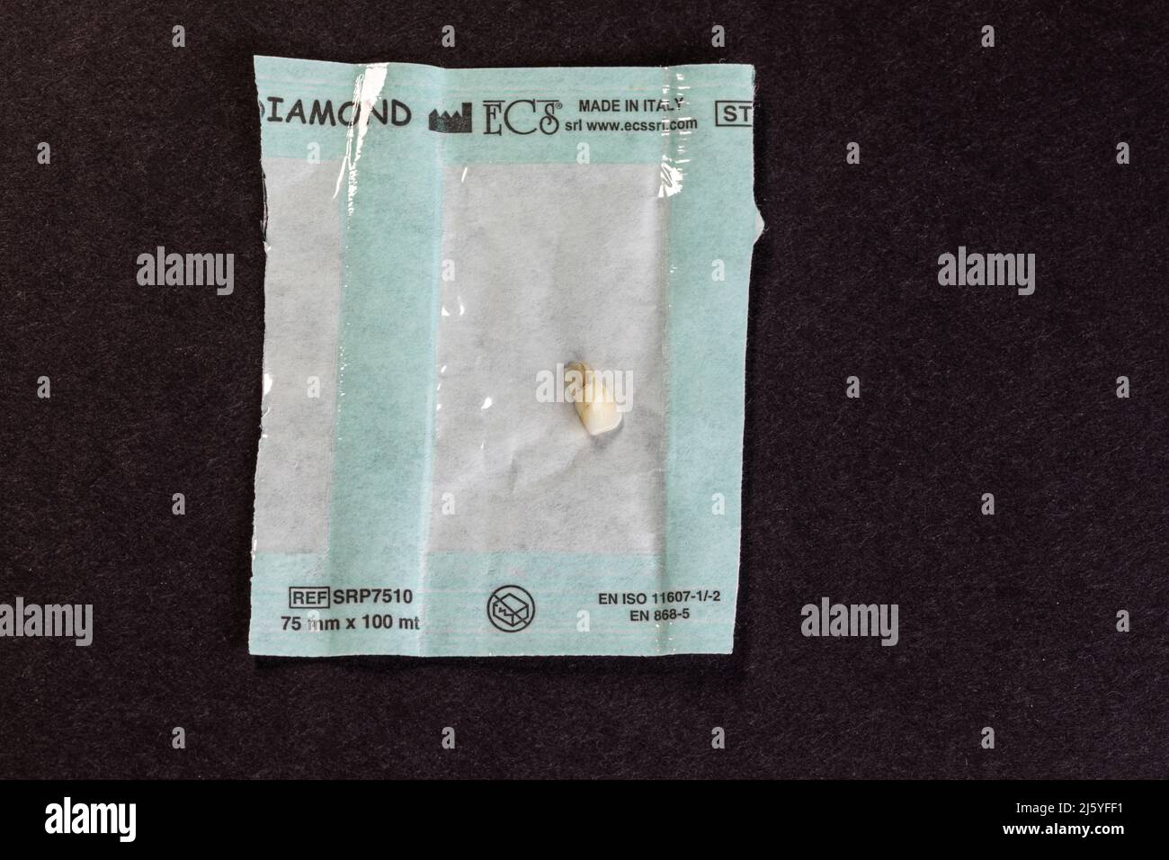 Extracted baby Calf's teeth stored in a plastic bag Stock Photo - Alamy