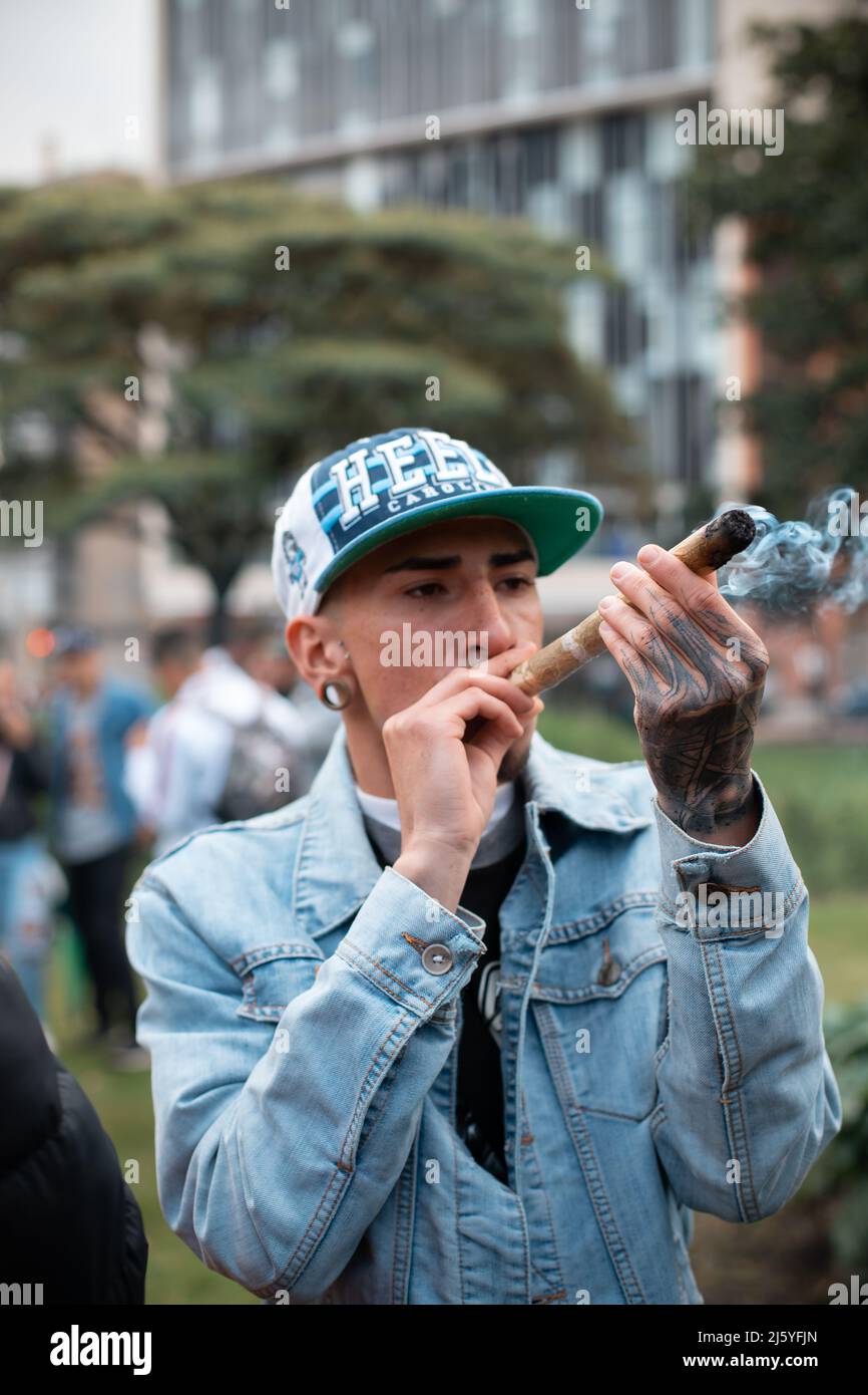 Bogotá, Colombia - April 20th, 2022: young man smoking marijuana from a ...
