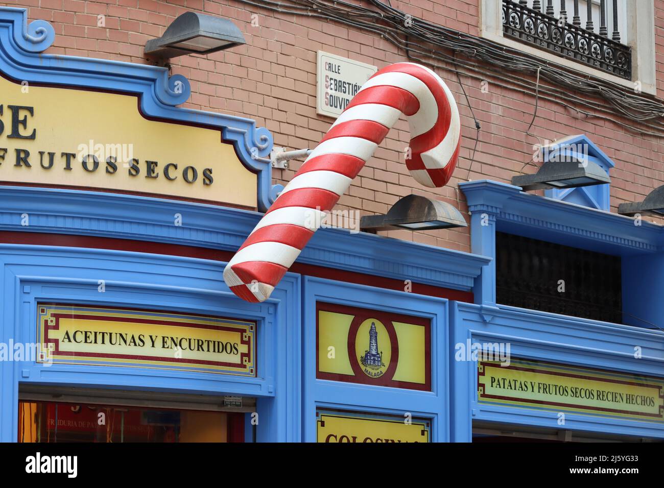 Candy cane shop sign, Malaga, Spain Stock Photo - Alamy