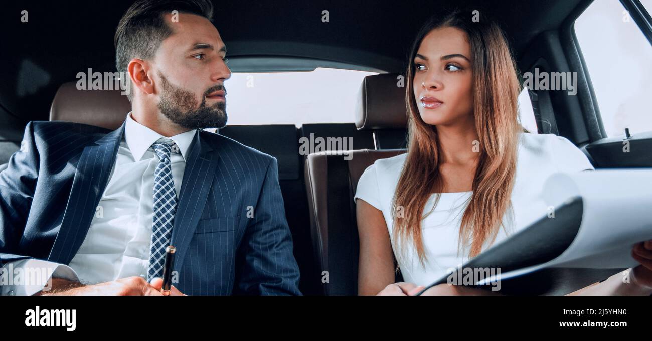 Business team working together in the car Stock Photo - Alamy