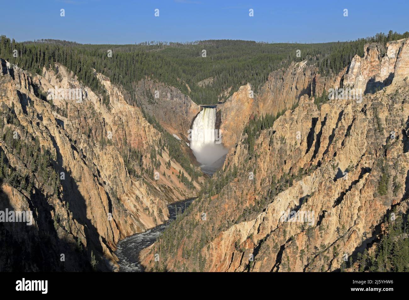 The famous and scenic Yellowstone Falls at Yellowstone National Park is ...