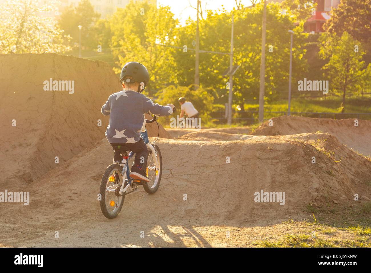 Child riding a cycle hi-res stock photography and images - Alamy