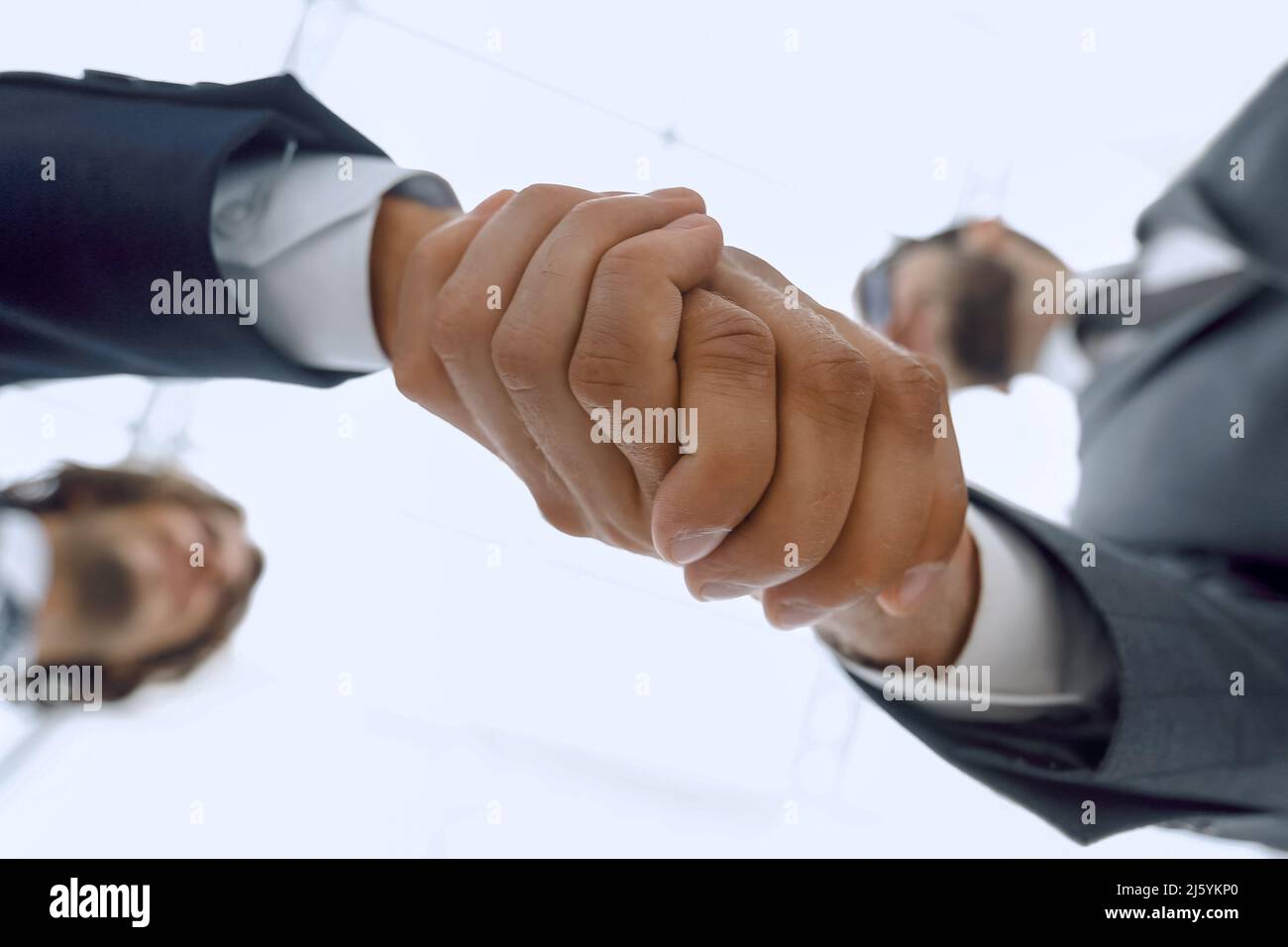 handshake in office, bottom view Stock Photo - Alamy