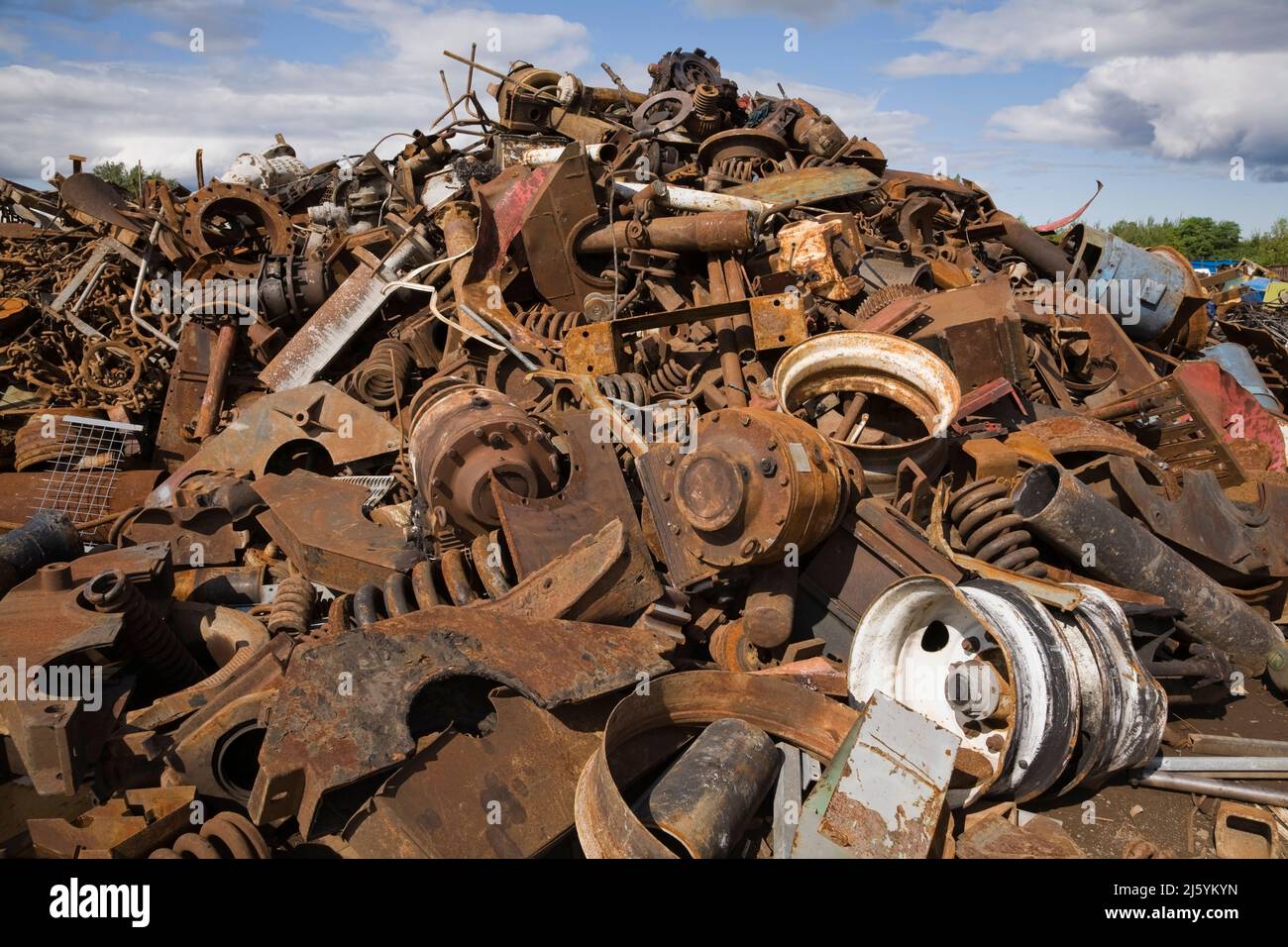 Pile of assorted discarded rusted parts and pieces made of iferous ...