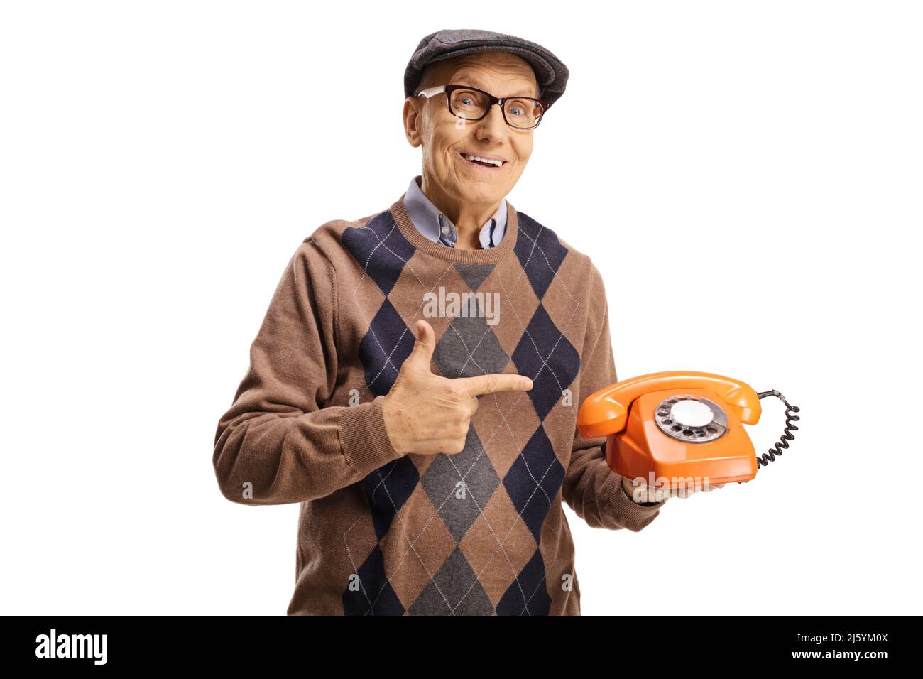 Elderly man holding an old vintage rotary phone and pointing isolated ...