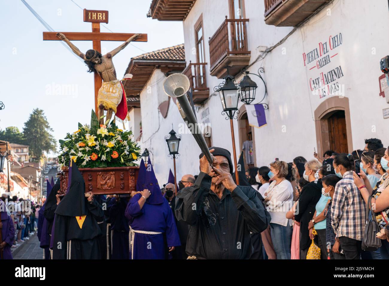 Roman Catholic hooded penitents wearing traditional capirotes, carry a ...