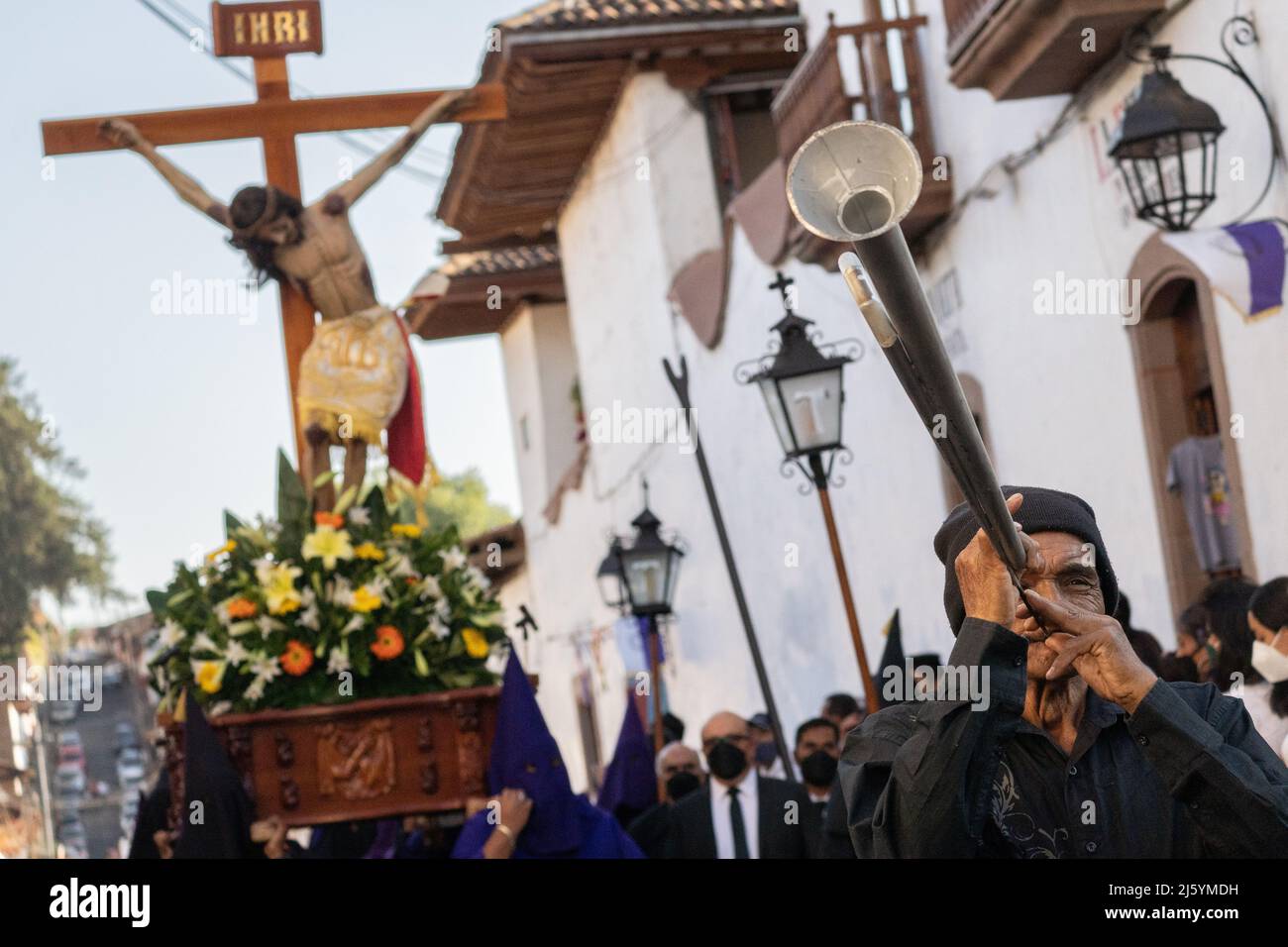 Roman Catholic hooded penitents wearing traditional capirotes, carry a ...