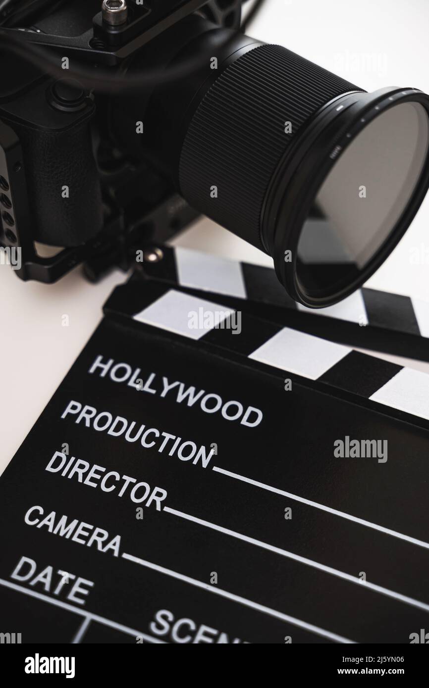 Modern black mirrorless camera rig and clapperboard Stock Photo - Alamy