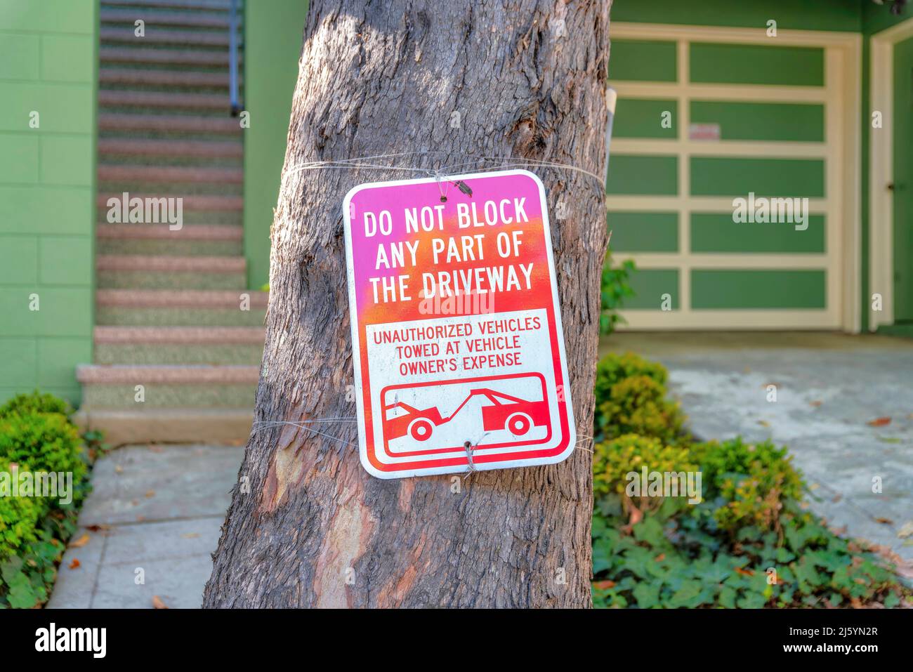 Do not block the driveway signage on a tree trunk at San Francisco ...