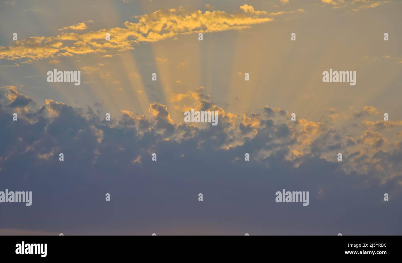 Beautiful dramatic sky with sun rays and clouds. Background for ...