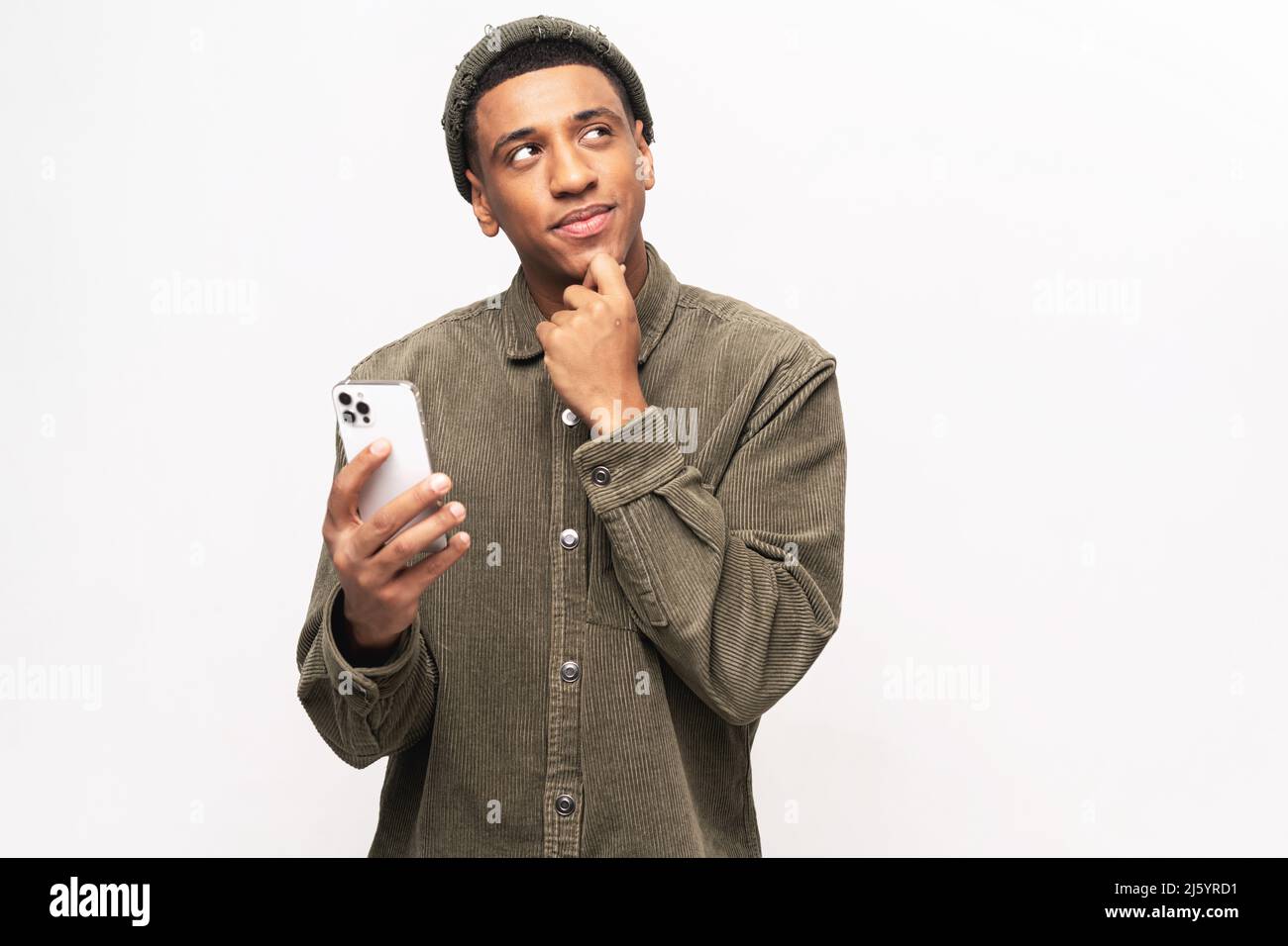 Photo of millennial guy hold telephone hand raise index finger up have ...