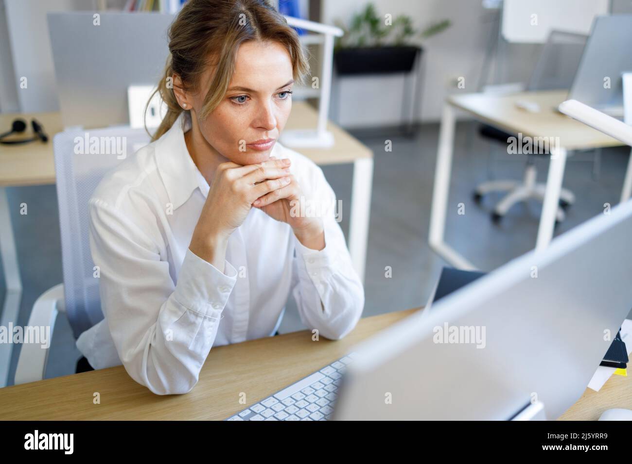 Serious middle aged businesswoman thinking hi-res stock photography and ...