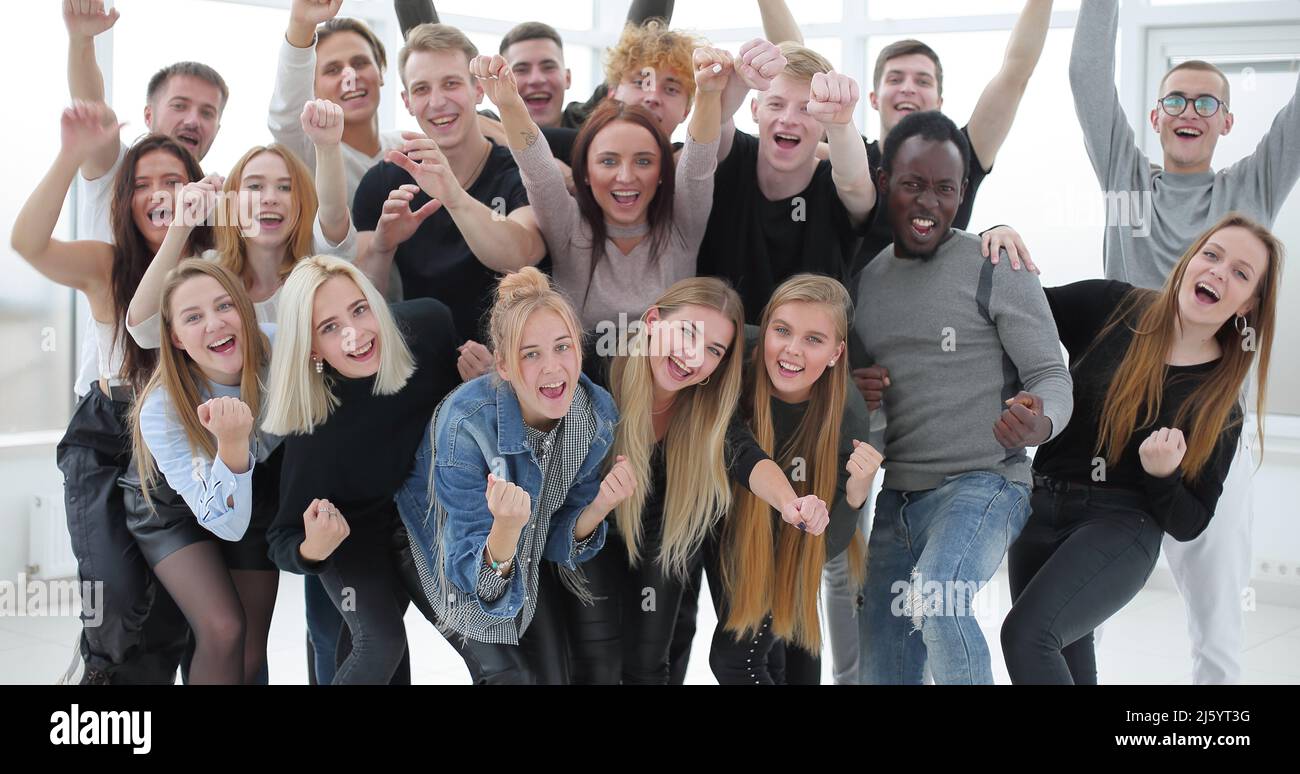 close up. a jubilant group of cheerful young people. isolated on white ...