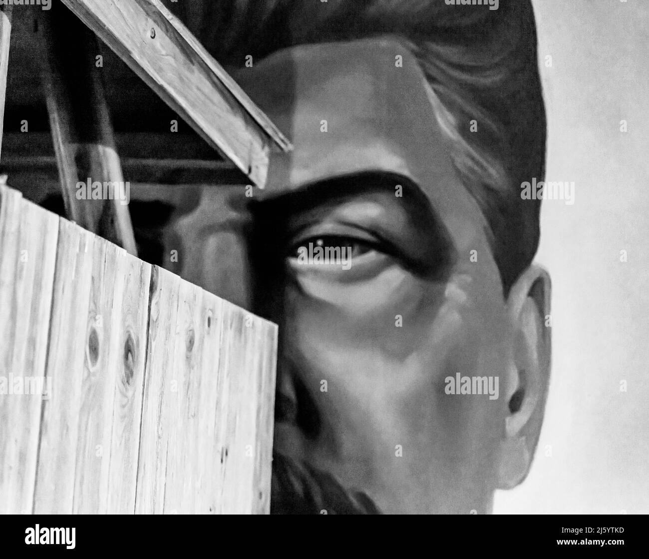 Portrait of Stalin watching behind watchtower Karlag Museum, Kazakhstan ...