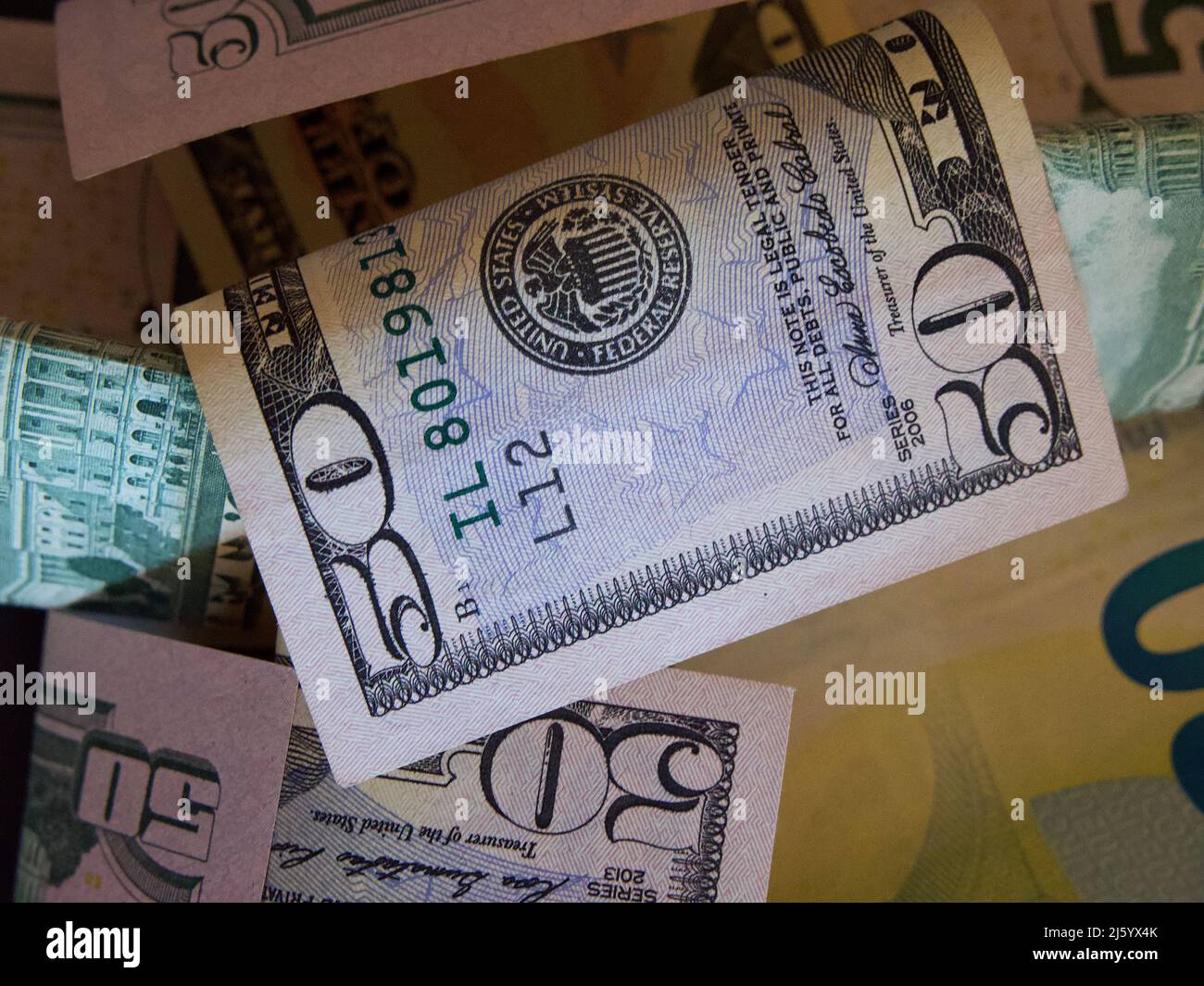 Cash banknotes dollars and euros are mixed up, a close-up shot Stock ...