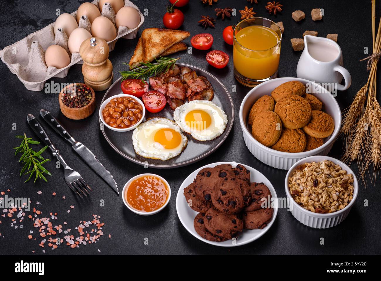 A delicious nutritious healthy breakfast with fried eggs, bacon, beans ...