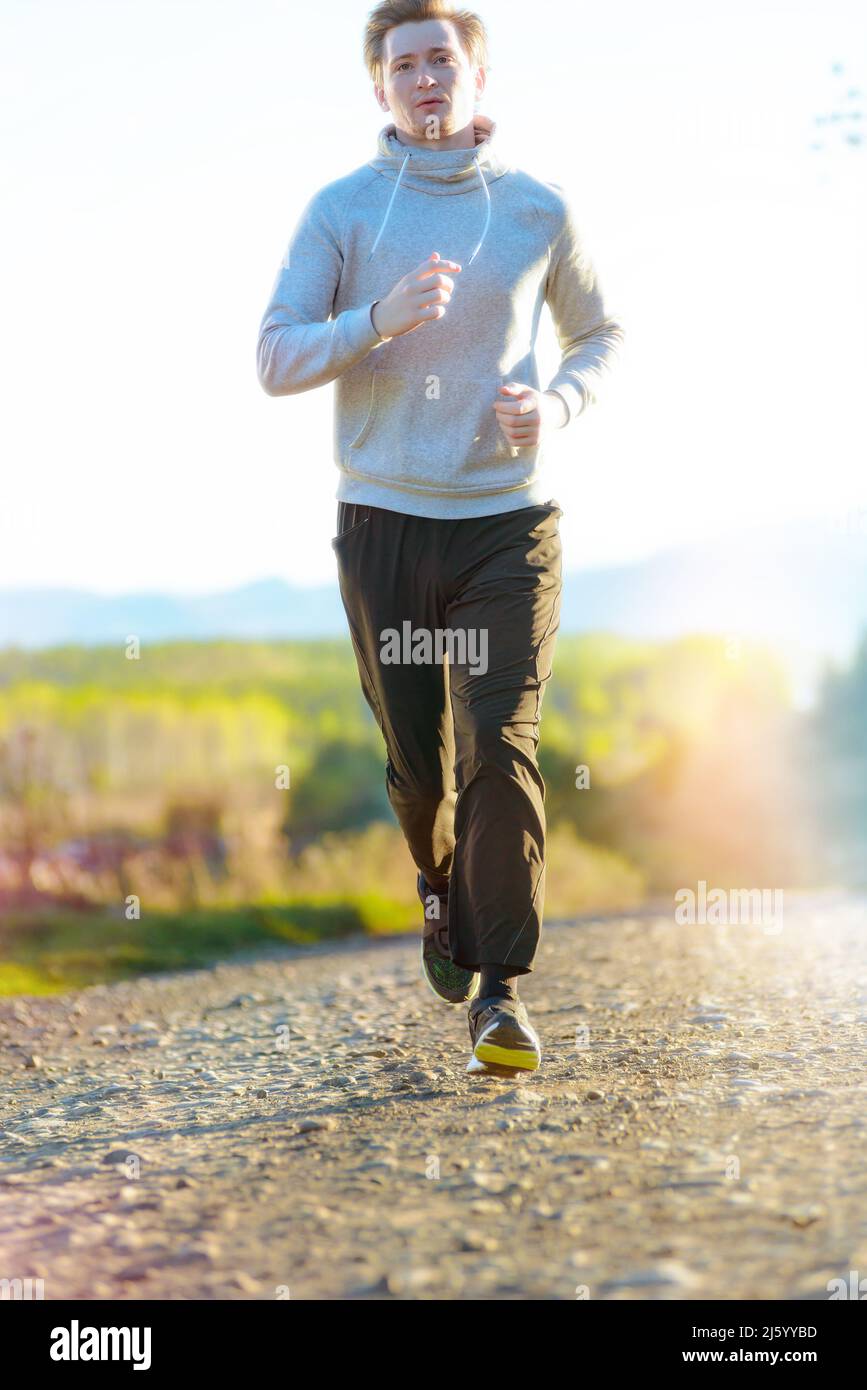 Running man jogging in rural nature at beautiful summer day. Sport ...