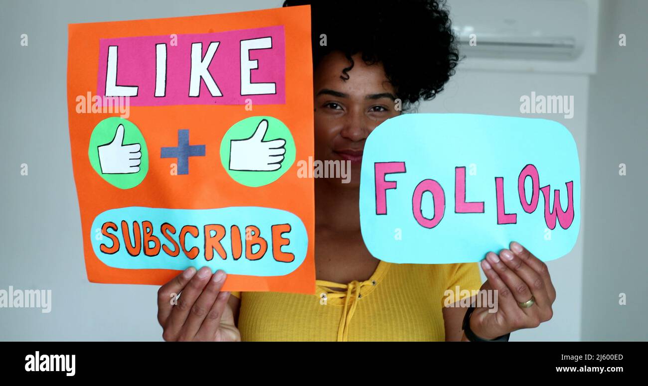 African American female vlogger asking audience to like, subscribe, and ...