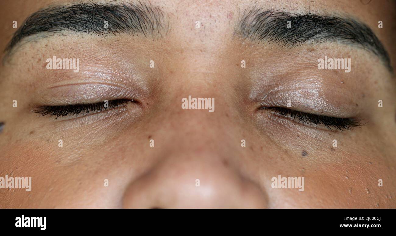 African black woman opening and closing eyes in meditation. Mixed race ...