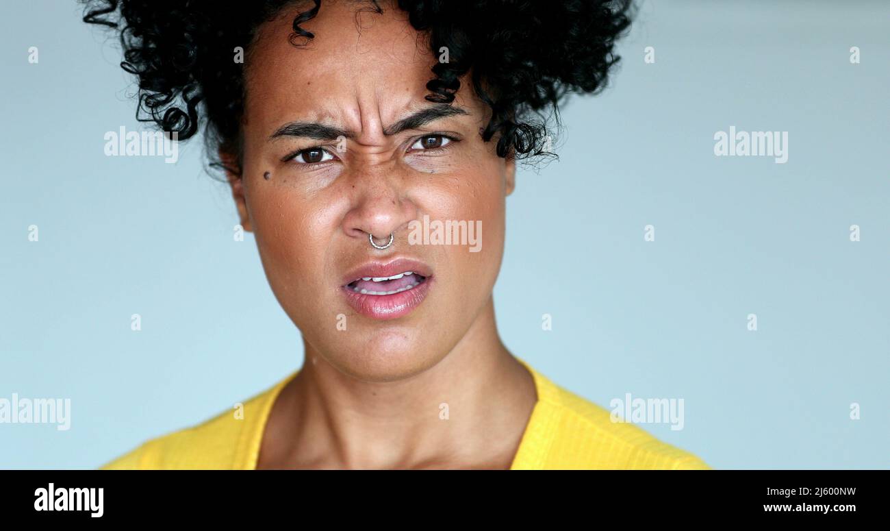 Annoyed black woman with surprise shock reaction Stock Photo - Alamy
