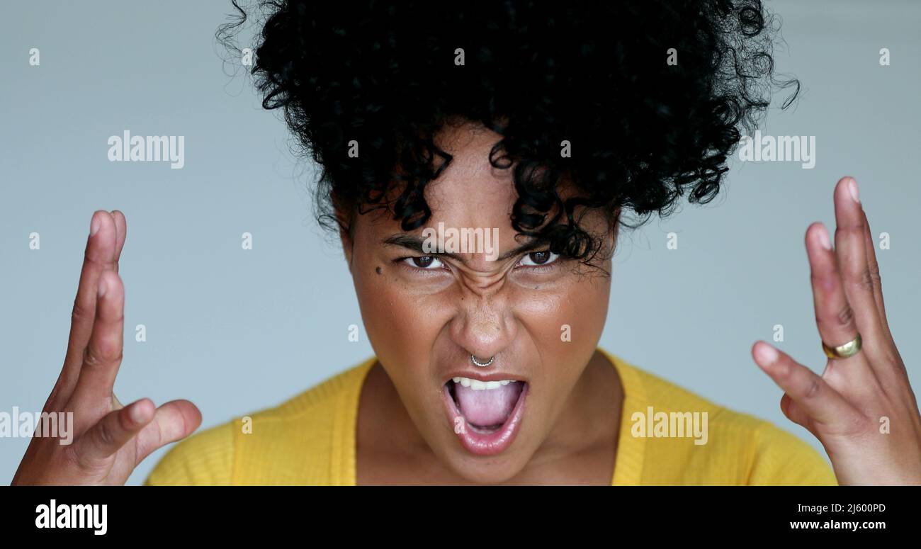 Angry young hispanic black woman shouting Stock Photo - Alamy