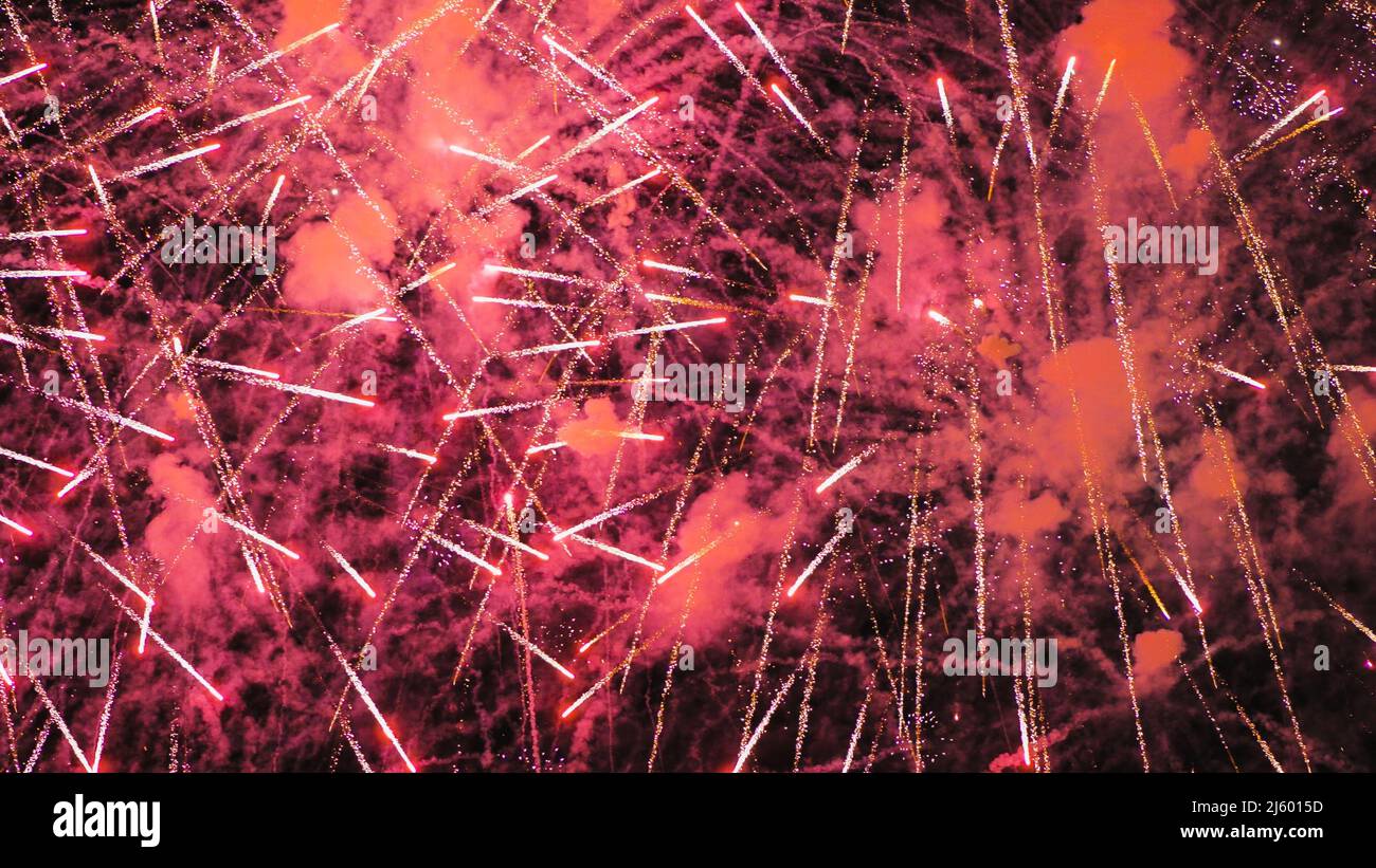 A colourful explosion of red fireworks in the night sky Stock Photo - Alamy