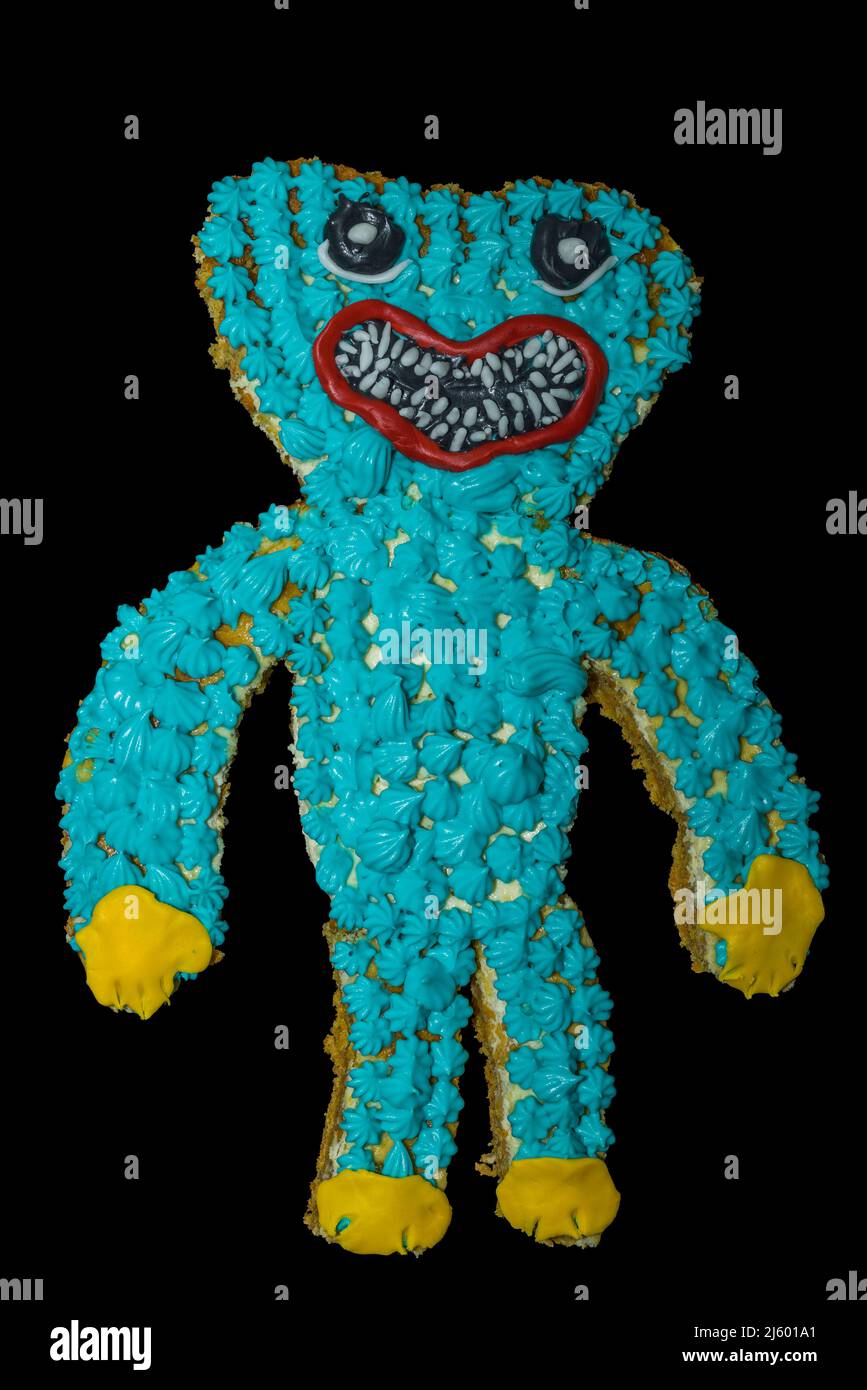Close up view of colorful handmade birthday cake in form of Huggy Wuggy ...