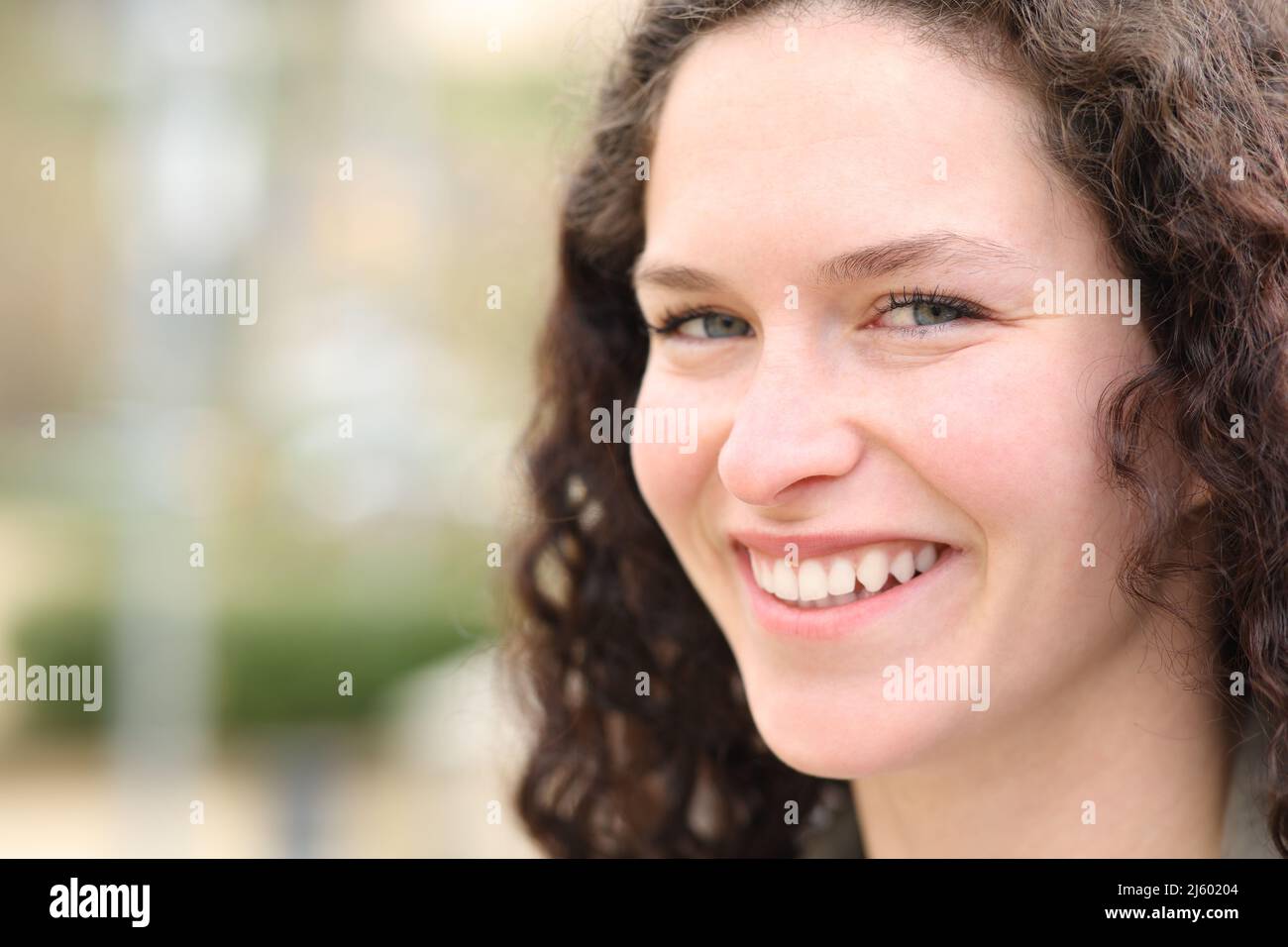 White teen girl looking up at camera and smiling hi-res stock ...