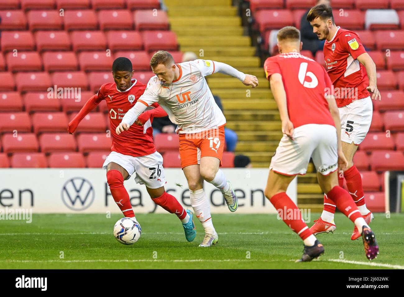 Shayne Lavery #19 of Blackpool breaks past Remy Vita #26 of Barnsley ...
