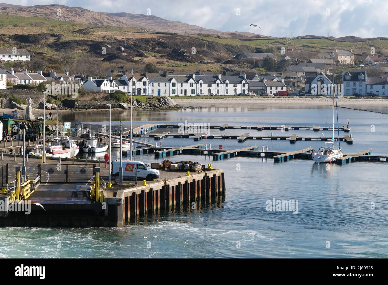 A view of the pier at Port Ellen, Islay, Scotland as the ferry departs ...