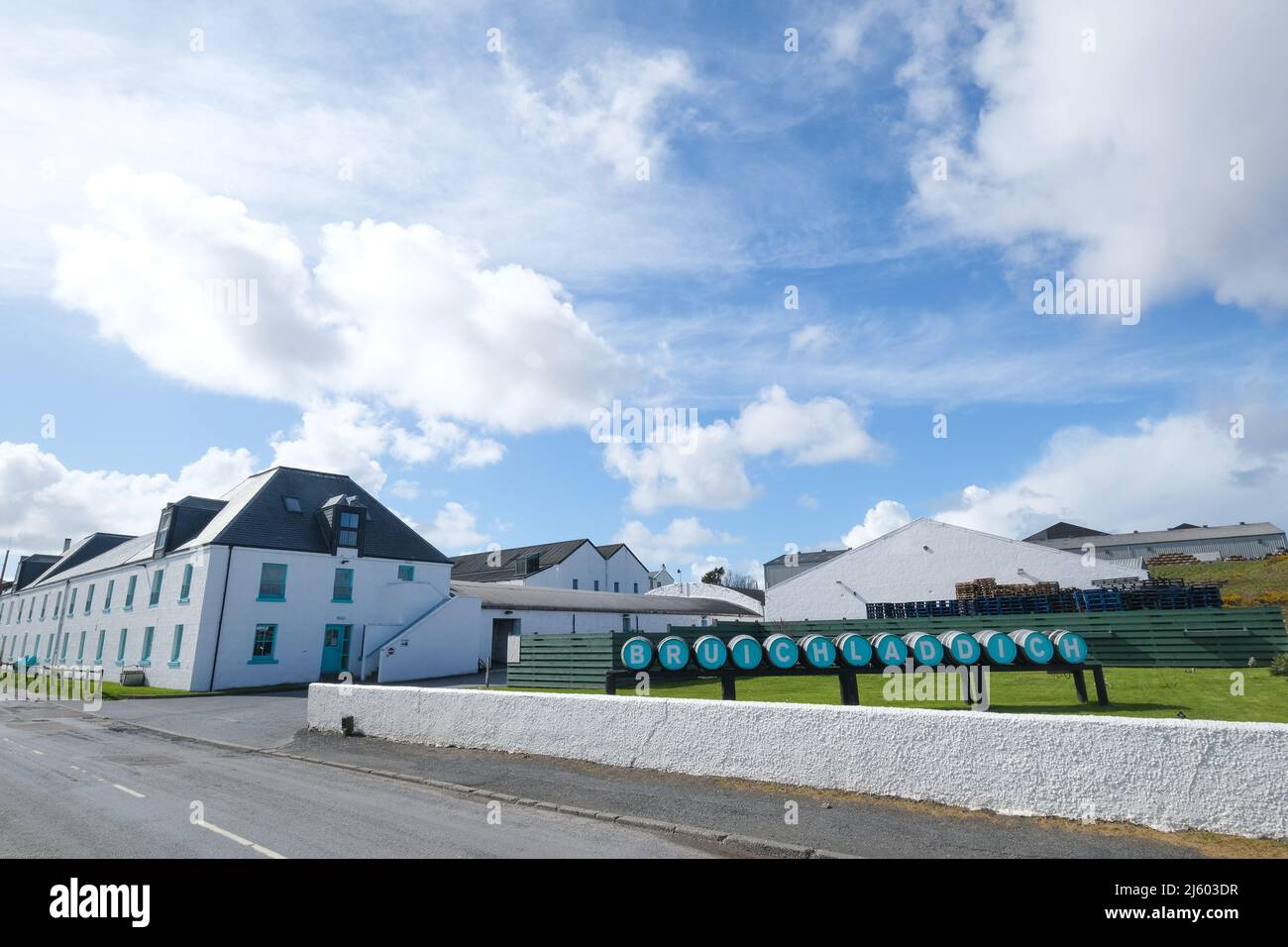 Exterior view of the lochside, whitewashed, Bruichladdich distillery ...