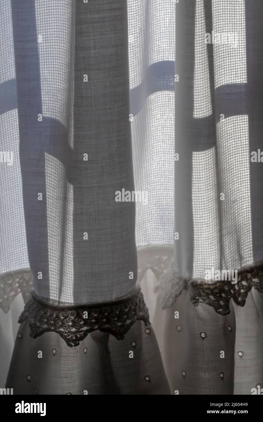 Translucent curtains and sunshine at a home in Michigan, USA Stock ...