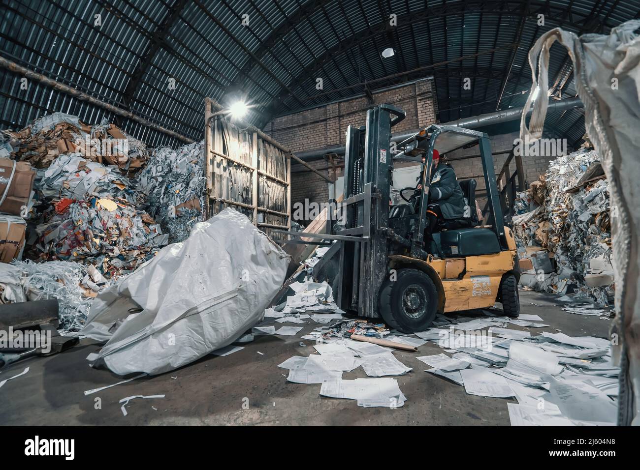 Waste paper sorting and filing for processing at paper recycling plant ...