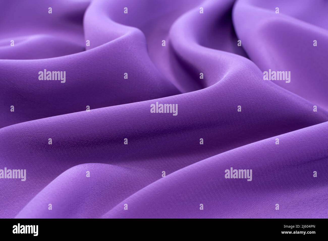 A piece of purple cloth. Fabric texture for background and design works ...