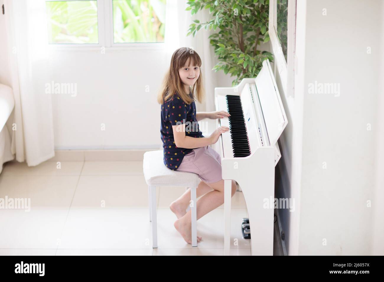 Child playing piano. Kids play music. Classical education for children ...