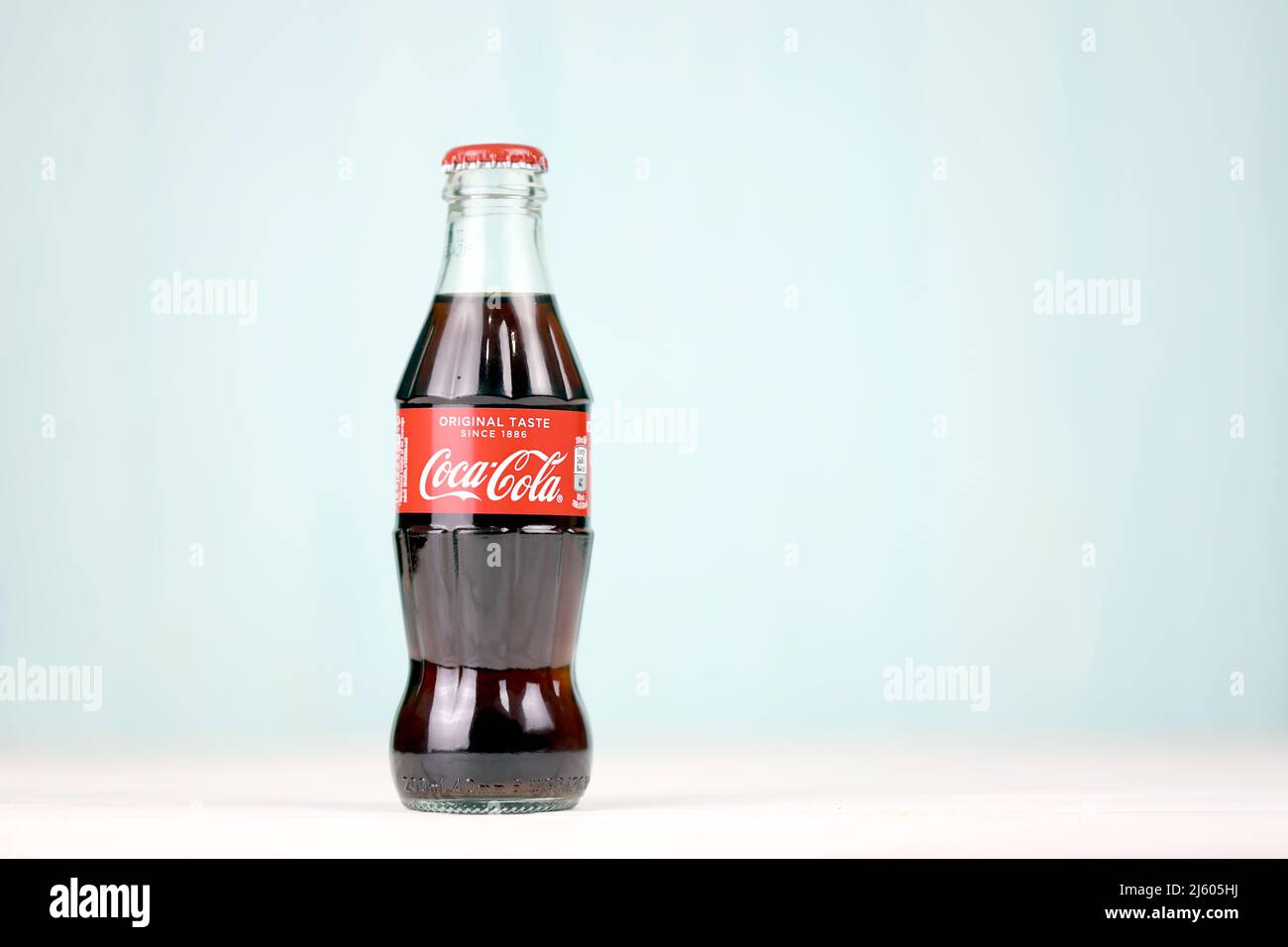 KHARKIV, UKRAINE - DECEMBER 16, 2021: Coca Cola production with classic ...
