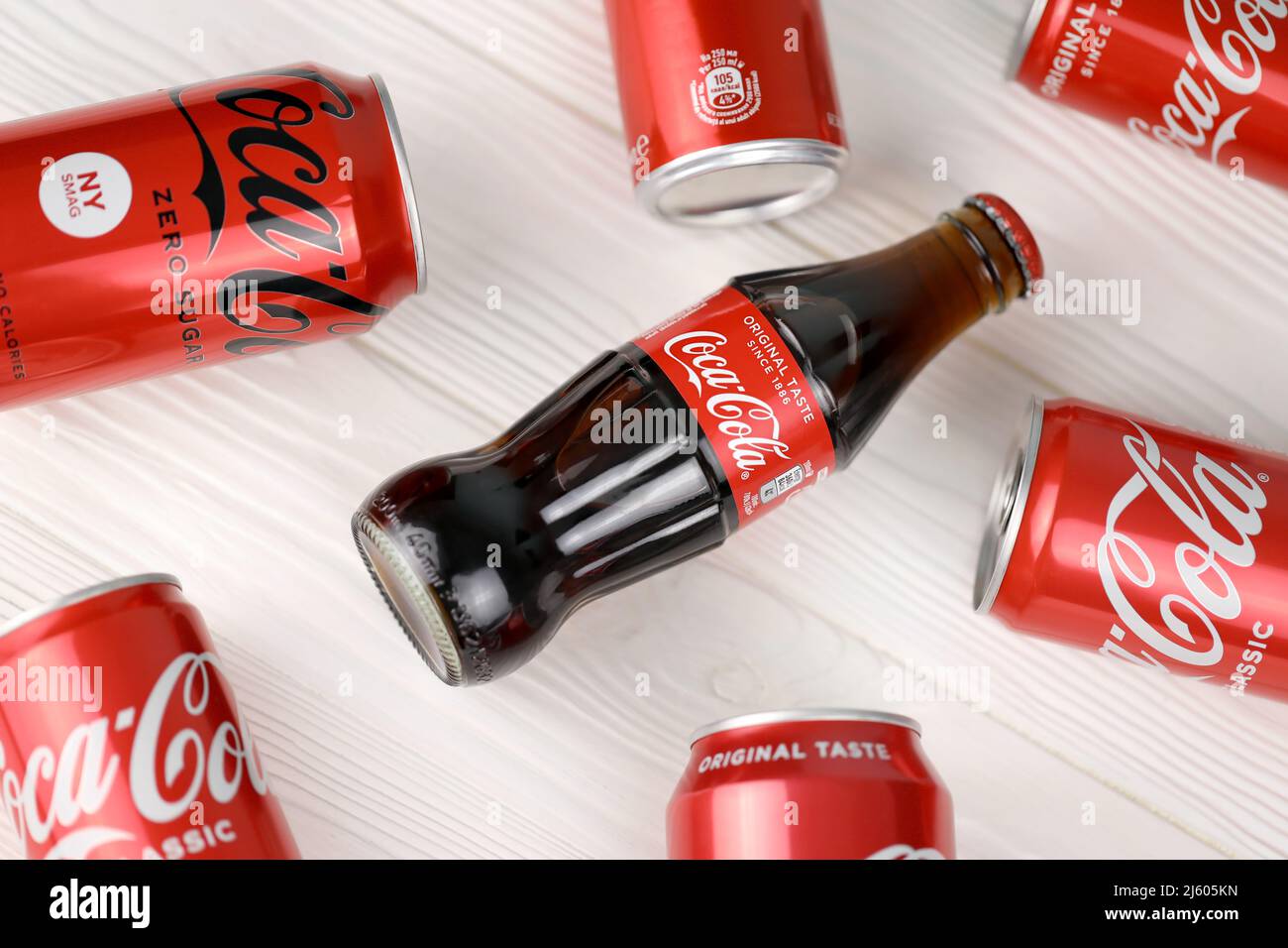 KHARKIV, UKRAINE - DECEMBER 16, 2021: Coca Cola production with classic ...