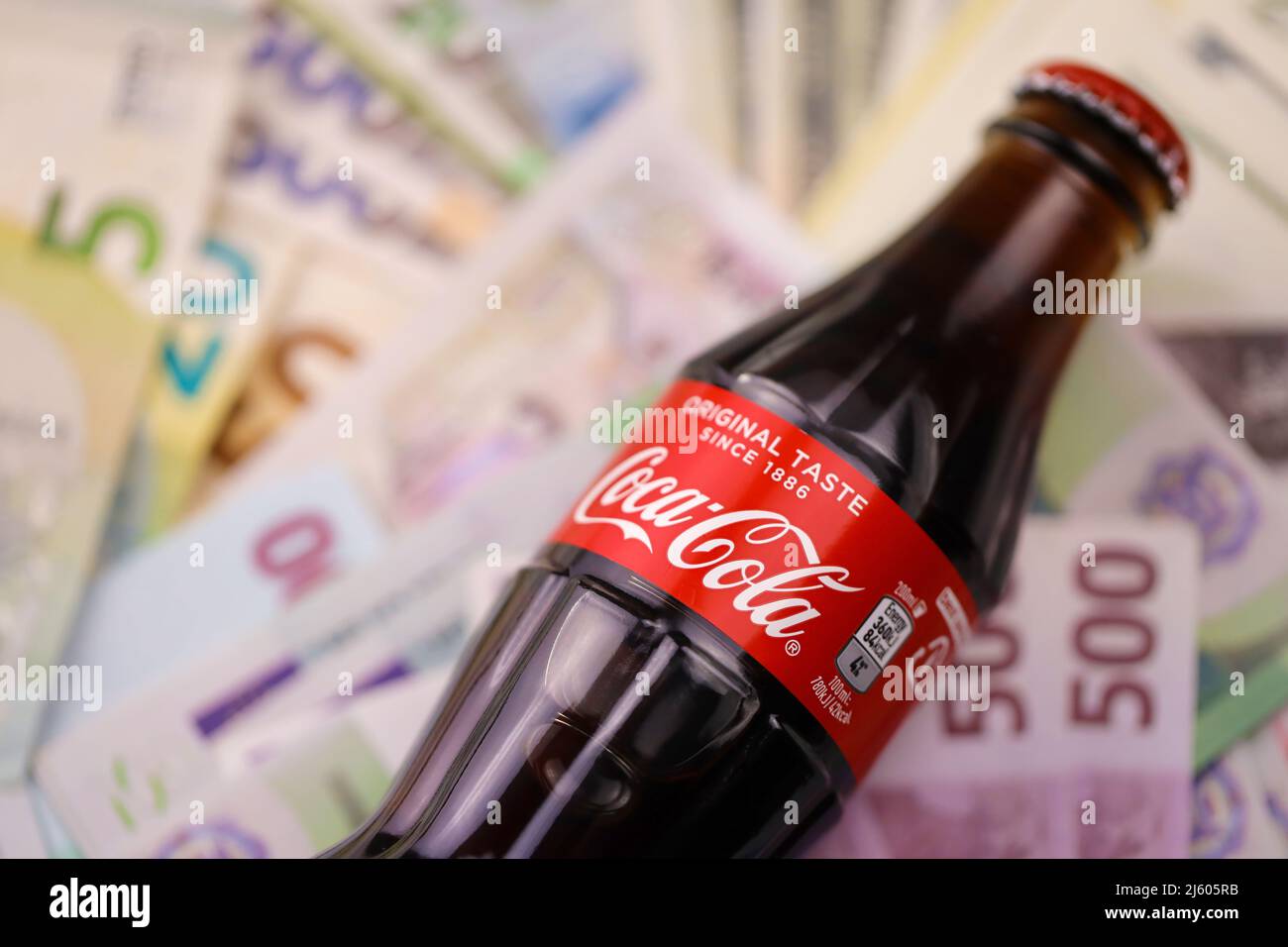 KHARKIV, UKRAINE - DECEMBER 16, 2021: Coca Cola production with classic ...