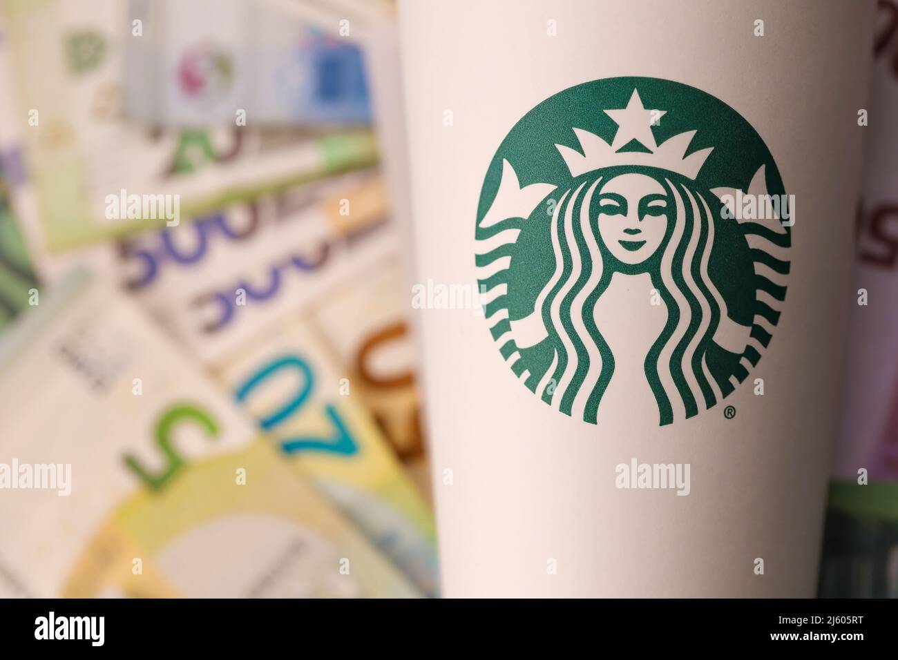 KHARKIV, UKRAINE - DECEMBER 16, 2021: White paper cup with Starbucks ...