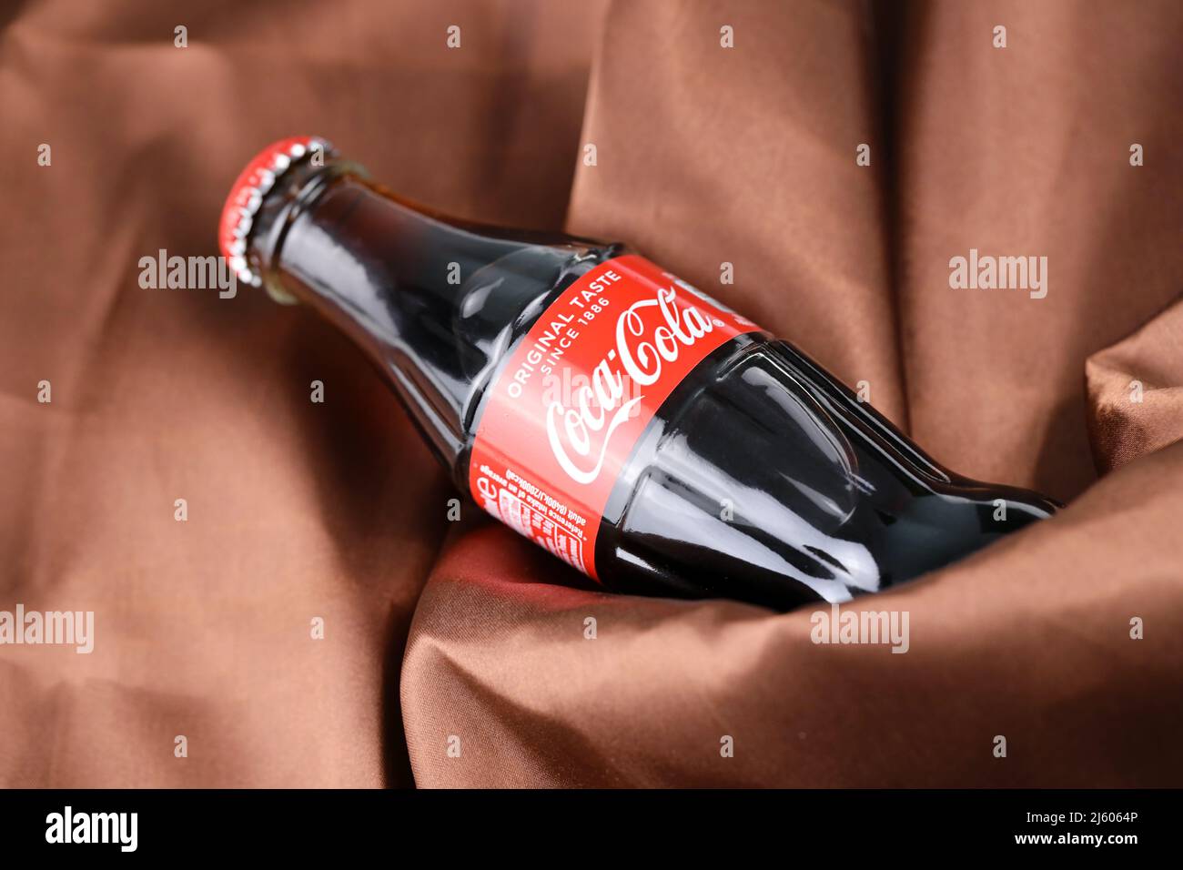 KHARKIV, UKRAINE - DECEMBER 16, 2021: Coca Cola production with classic ...