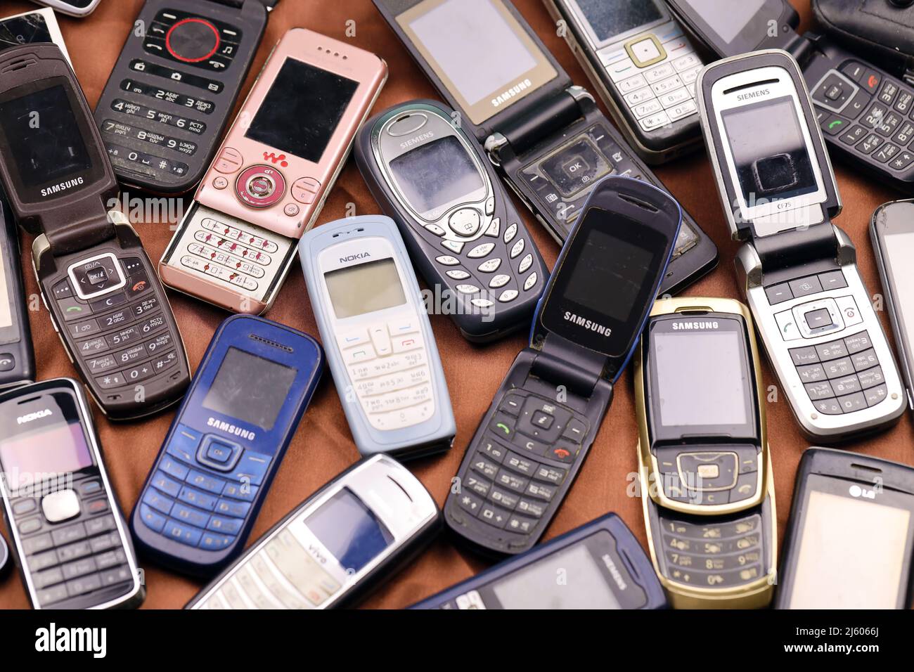 KHARKIV, UKRAINE - DECEMBER 16, 2021: Some old used outdated mobile ...