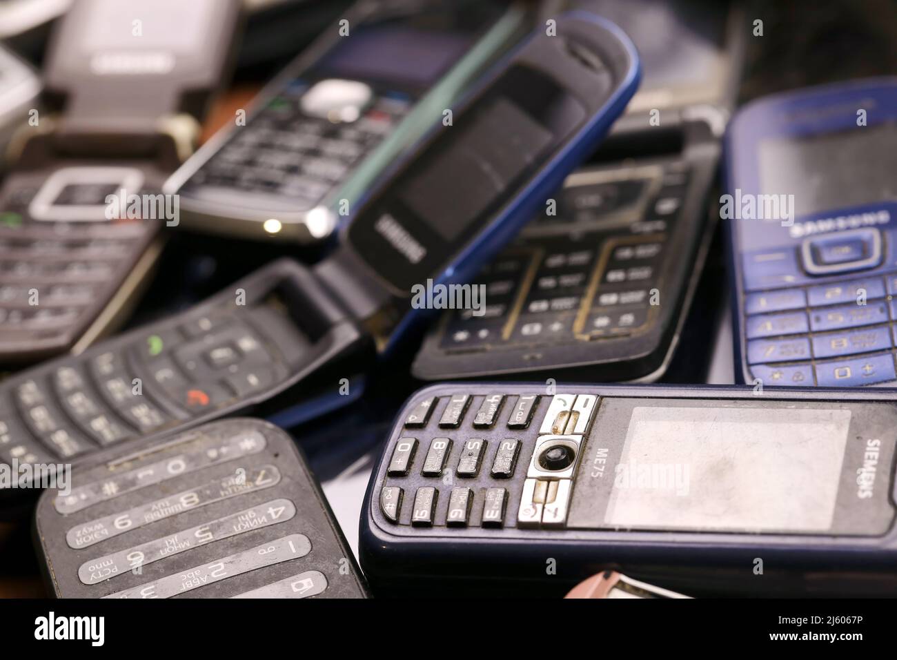 KHARKIV, UKRAINE - DECEMBER 16, 2021: Some old used outdated mobile ...