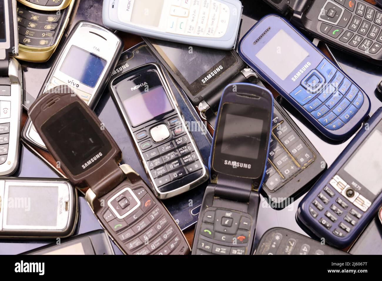 KHARKIV, UKRAINE - DECEMBER 16, 2021: Some old used outdated mobile ...