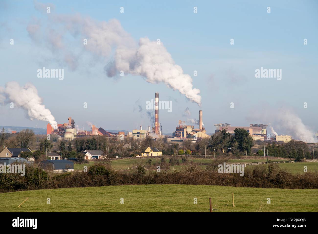 Large factory with smoky chimneys, sky covered with smoke Stock Photo ...
