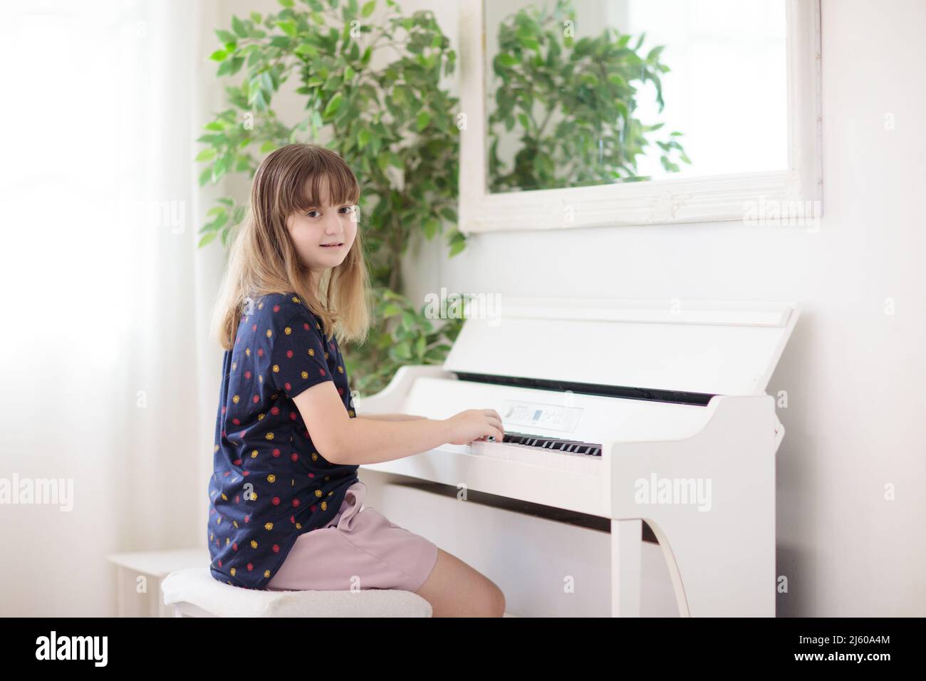 Child playing piano. Kids play music. Classical education for children ...