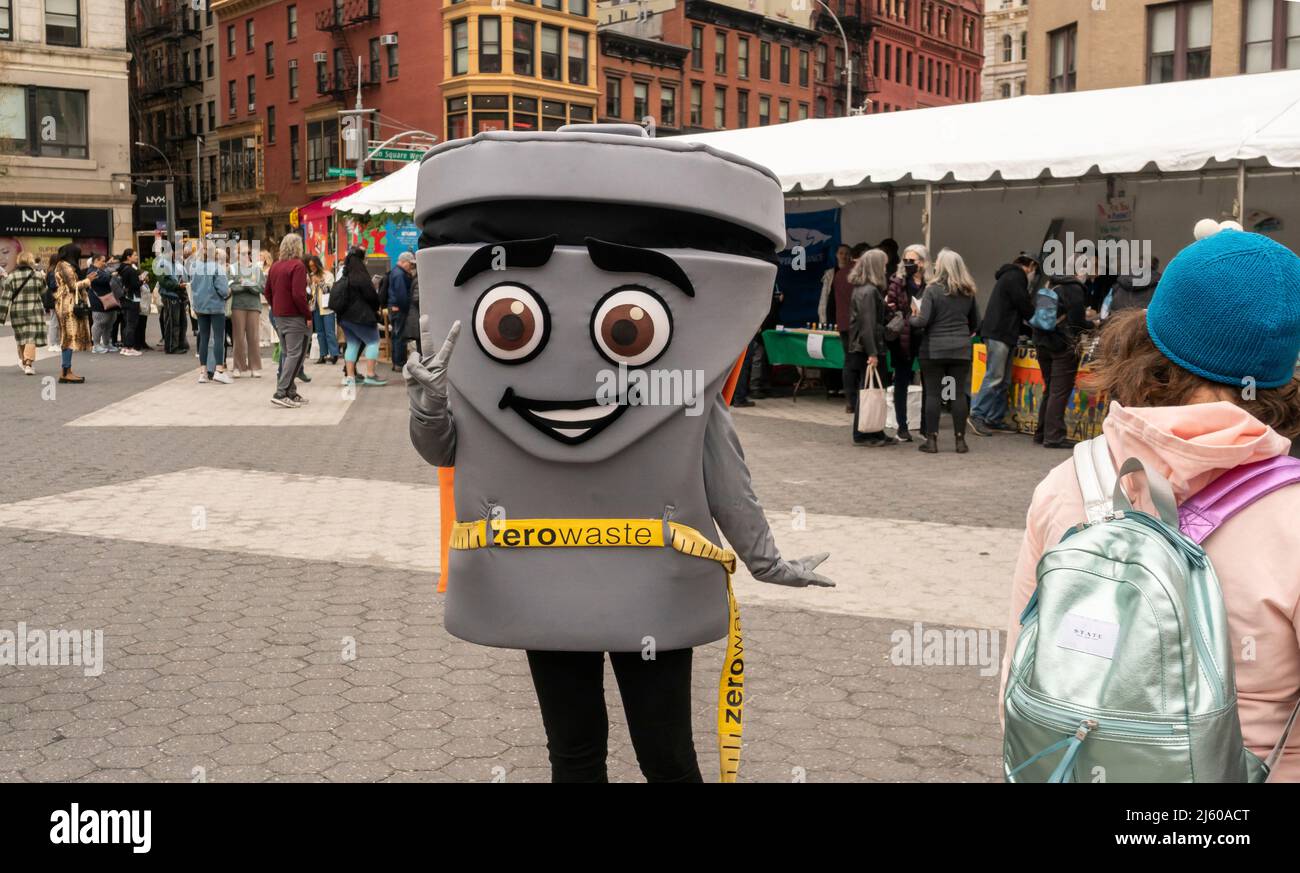 Costumed recyclable trash can actor interacts with visitors at the ...