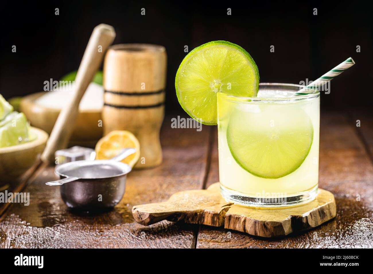 Lime alcoholic drink, made in Brazil, called caipirinha, with ice and ...